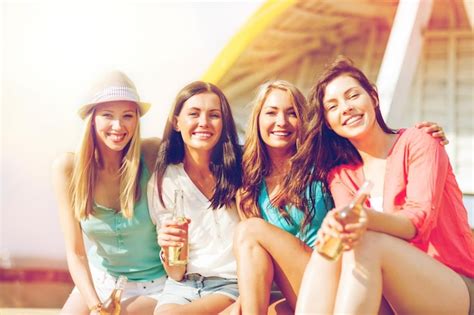 Premium Photo Summer Holidays And Vacation Girls With Drinks On The
