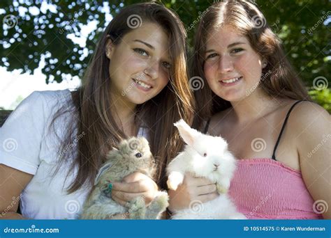 Two Teenage Girls With Bunnies Stock Image Image Of Gray Rabbits