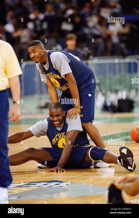Michigan Forward Chris Webber 4 And Guard Jimmy King Limber Up During