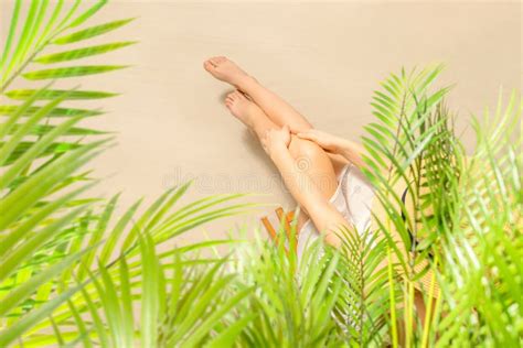 Alone Woman Applying Sunscreen On Skin Sitting Under Palm Tree Branches Female Relaxation On