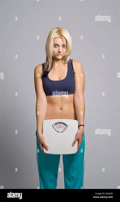 Girl Holding Scale Stock Photo Alamy