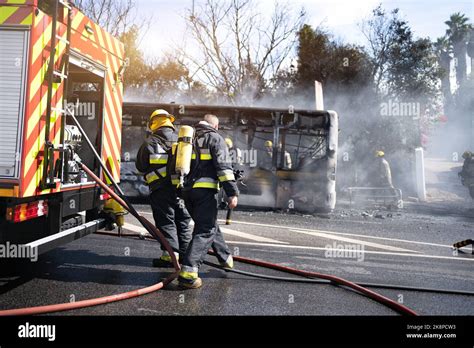 Rescue Team Of Firefighters Arrive On The Car Crash Fired Passenger Bus Traffic Accident Scene