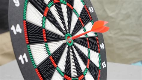 Premium Stock Video Close Up Plastic Outdoor Dart Thrown At Board