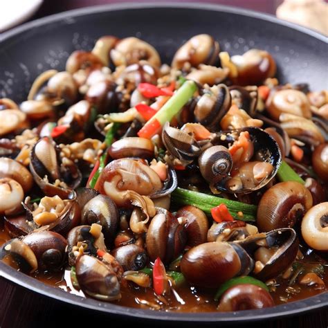 Premium Ai Image Chinese Food Stir Fried Snails With Thirteen Spices