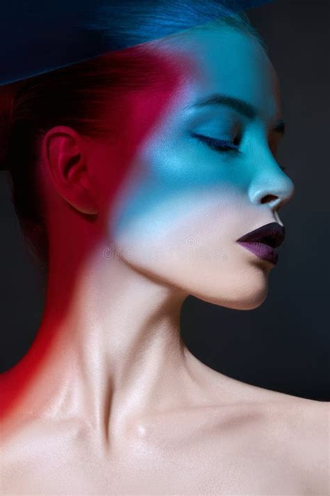 Bright Contrasting Beauty Makeup Portrait Of A Woman In Blue And Red