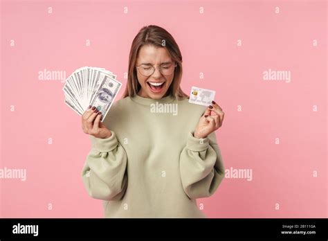 Portrait Of Nice Excited Woman In Eyeglasses Holding Banknotes And