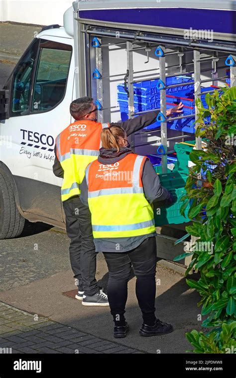 Unusual Two Tesco Supermarket Staff Working Together Assumed Training