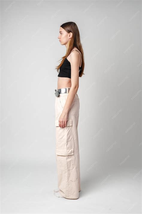 Premium Photo Young Woman Wearing Beige Cargo Pants And A Black Crop