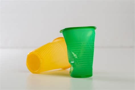 Premium Photo Multicolor Disposable Plastic Glasses Isolated On White