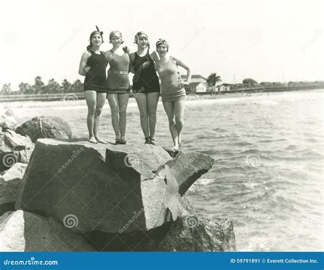 Women In Bathing Suits Posing On Rock Stock Image Image Of Friendship
