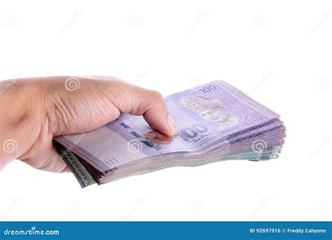 A Hand Giving A Stack Of Malaysian Ringgit Stock Photo Image Of