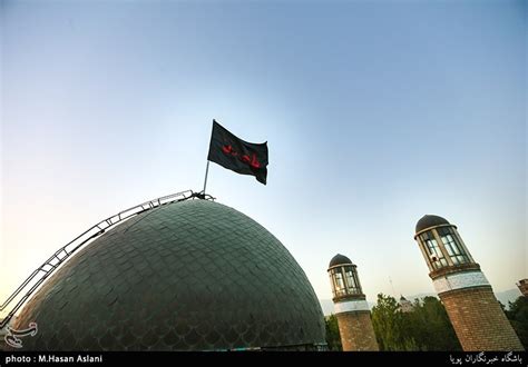 اهتزاز پرچم گنبد امام حسینع بر فراز مزار شهدای گمنامعکس تسنیم