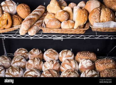 A Assortment Of Different Types Of Artisan Bread Displayed At A Bakery Stock Photo Alamy