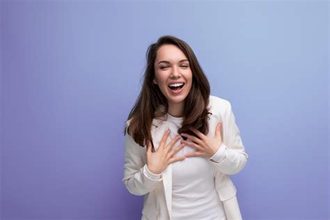Premium Photo Cheerful Brunette Woman In Ivory Jacket And White Dress