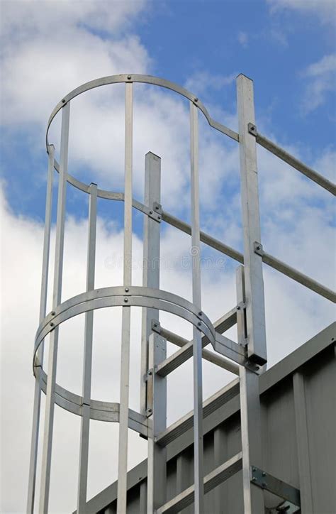 Iron Safety Cage Ladder For Rooftop Access To Prevent Falls Stock Image