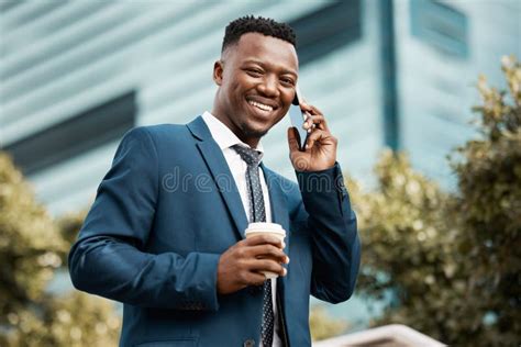 Hes Never Too Far From Reach A Handsome Young Businessman Using His