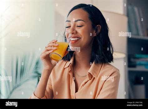 Orange Juice Drink And Happy Black Woman Relax While Drinking Health