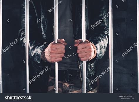 Handcuffed Man Behind Prison Bars Arrested库存照片1008164785 Shutterstock