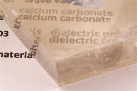 Optical Birefringence Demonstrated Using A Text Using A Natural Double Spar Calcite Crystal