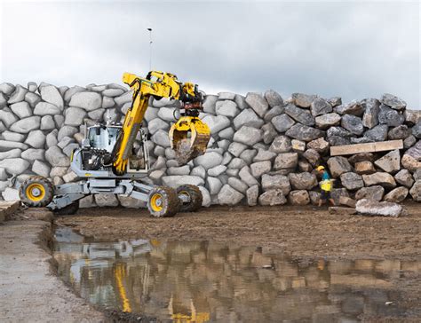 A Framework For Robotic Excavation And Dry Stone Construction Using On