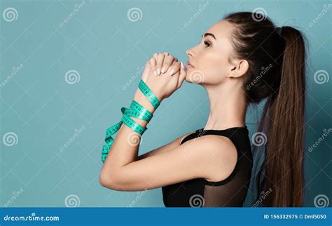 Diet Weight Loss Concept Pretty Sport Woman Hands Tied With A Centimeter Tape Measure Stock