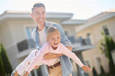 Premium Photo Dad Having Fun With His Daughter And Feeling Awesome