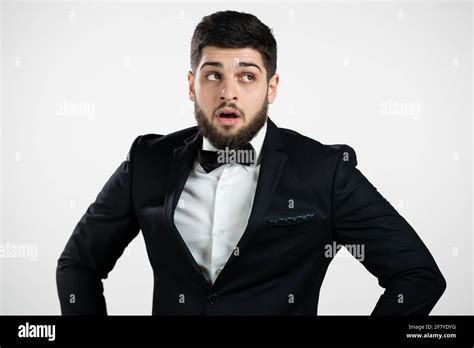 Irritated Man In Tuxedo Sighs Rolling Eyes On White Background