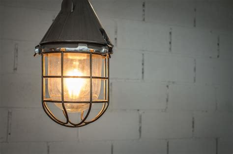 Premium Photo Close Up Of Illuminated Lighting Equipment Hanging On Wall