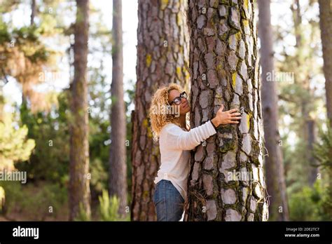 Happy Beautiful Woman Embrace Big Tree Trunk Enjoying Outdoors Nature