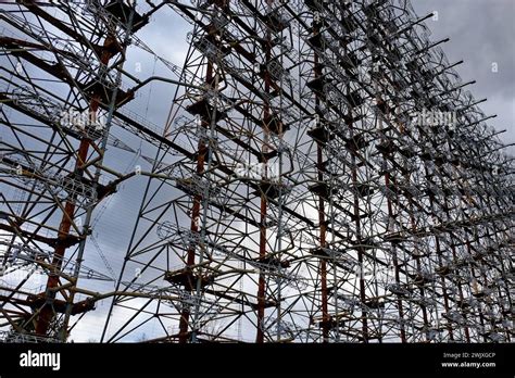 A Series Of Metallic Constructs Heavily Wired Showing Signs Of Rust