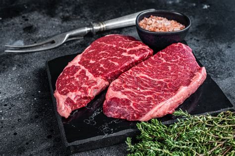 Fresh Raw Denver Steak Marble Beef Meat With Herbs Black Background