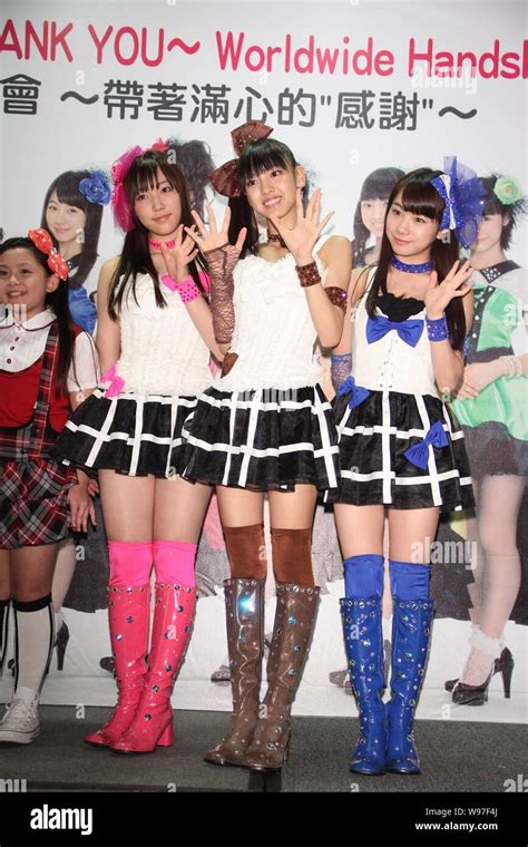 Members Of Japanese Pop Idol Girl Group Morning Musume Wave At A