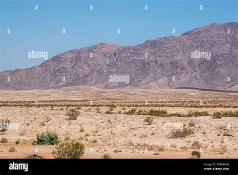 The United States Border Wall With Mexico Cuts Through The Landscape