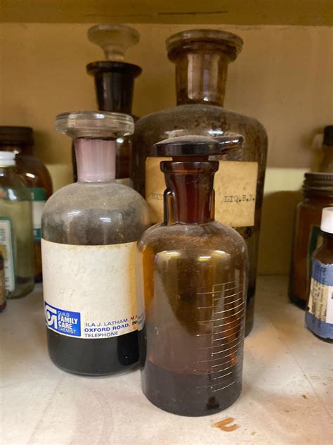 Lot Five Clear And Amber Glass Apothecary Bottles One With Measuring Grid