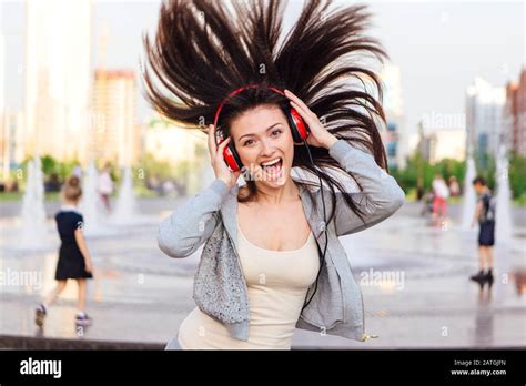 Girl Listening To Music Streaming With Headphones Stock Photo Alamy