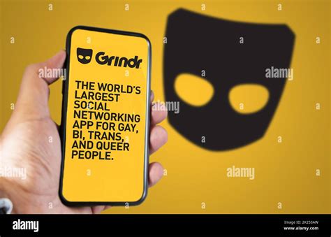 San Francisco CA US May 2022 Hand Holding A Phone With Grindr