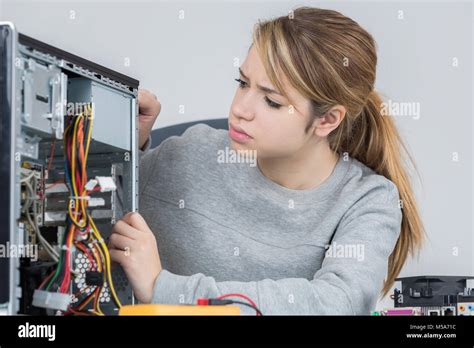Girl With A Tester And A Printed Circuit Board Stock Photo Alamy