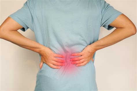 Premium Photo A Man Has Chronic Lower Back Pain And Suffers From