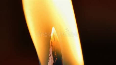 a close up of a candle flame with a warm glow creating a cozy
