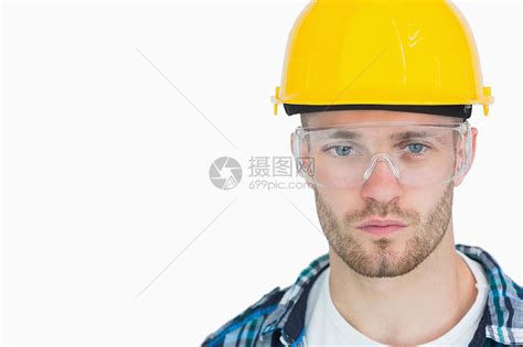 身戴防护眼罩和硬帽的建筑师肖像工作服承包商男性男人建筑工人领班护目镜头盔职业黄色高清图片下载 正版图片321751477 摄图网