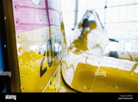 Part Of And Close Up Of Restored Stationary Propeller Plane Indoors