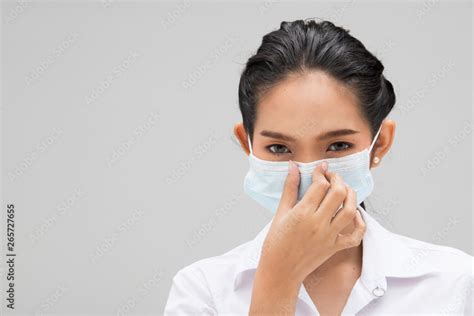 Young Asian University Student Woman In White Uniform Cover Face With