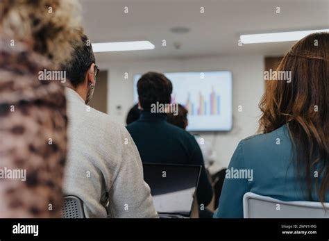 Successful Multi Generational Team Analyzing Growth And Brainstorming