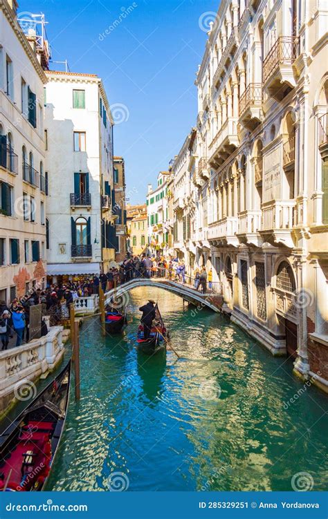 View Of Venice Canal Rio Del Palazzo Gondolas And Crowded Bridge Italy