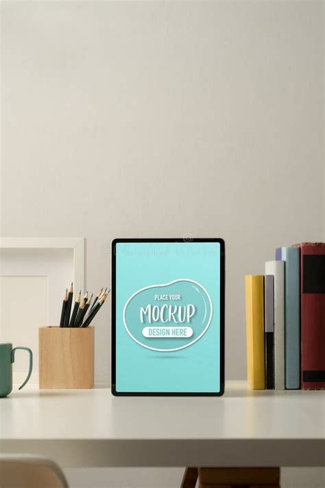 Mock Up Digital Tablet On Worktable With Stationery Books And Decoration In Home Office Room