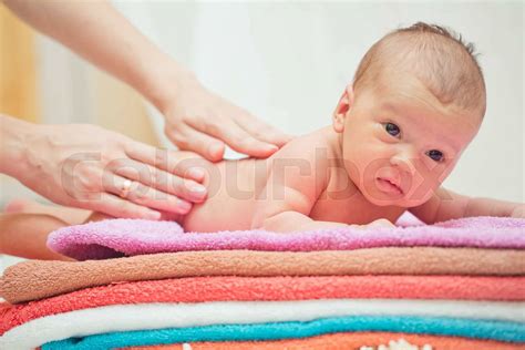Mother Massaging Infant Girl Colourbox