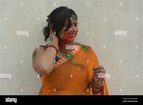 Portrait Of A Young Indian Girl Playing Holi Happy Female Enjoying In