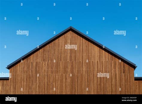 Facade Decoration Of The Roof Gable With Natural Wood Plank Of A New