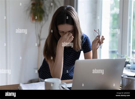 Exhausted Laptop User Girl Taking Glasses Off Touching Closed Eyes
