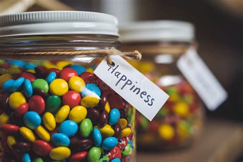 Colorful Candies In Jar Labeled Happiness Evoke Joy And Nostalgia Stock